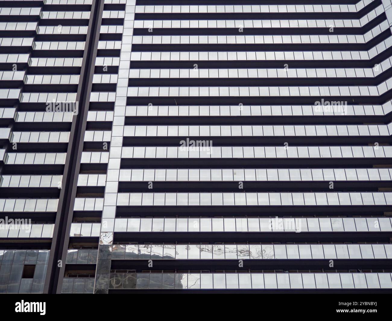 Construction of a modern multi-storey building. Glazed facade ...