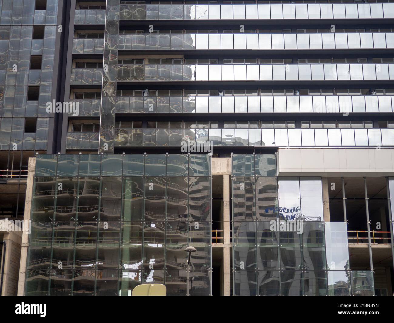 Construction of a modern multi-storey building. Glazed facade ...