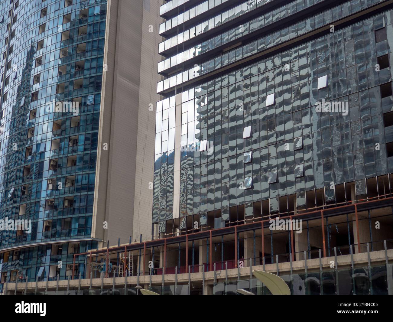 Construction of a modern multi-storey building. Glazed facade ...