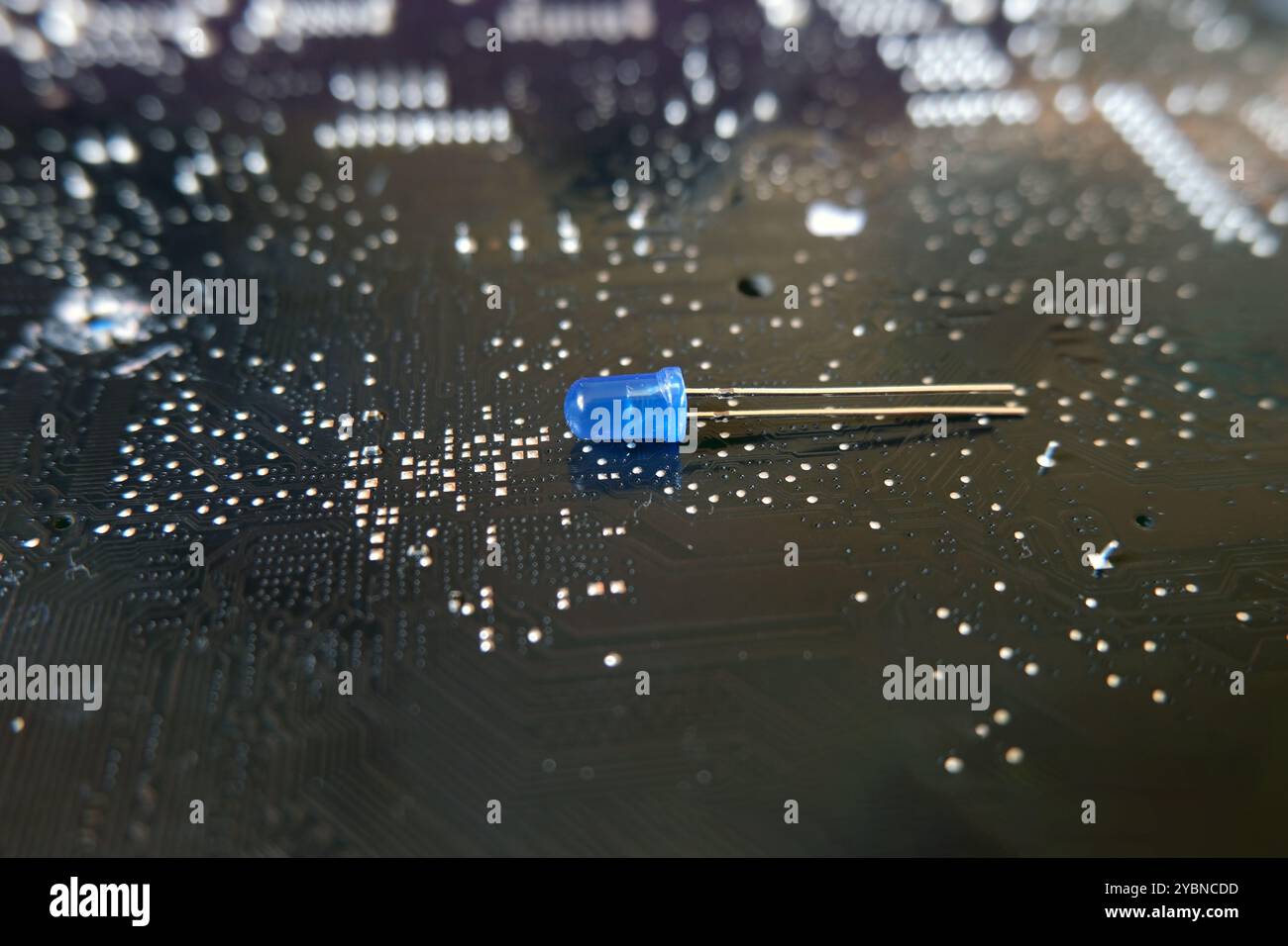 Single blue Light Emitting Diode (led) standing on the high technology ...