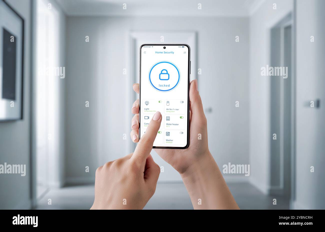 Hand holding a smartphone with a security app interface, controlling ...