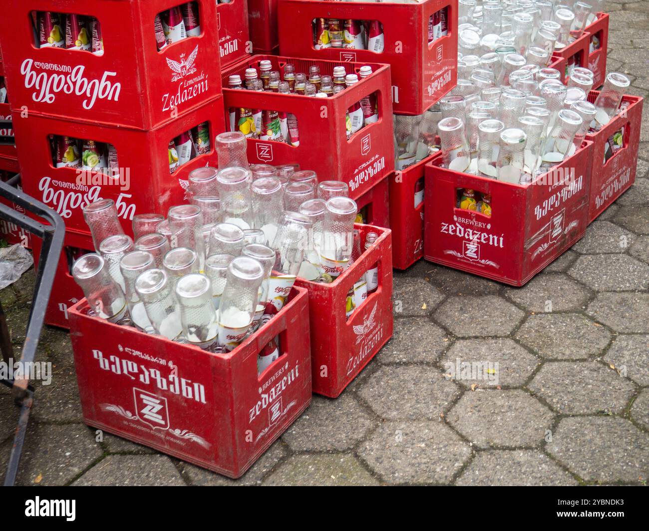 Batumi, Georgia. 06.18.2024 Lots of empty glass bottles in boxes. Empty ...