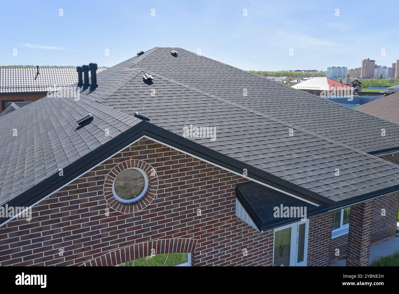 Luxury house roof with asphalt shingles Stock Photo - Alamy