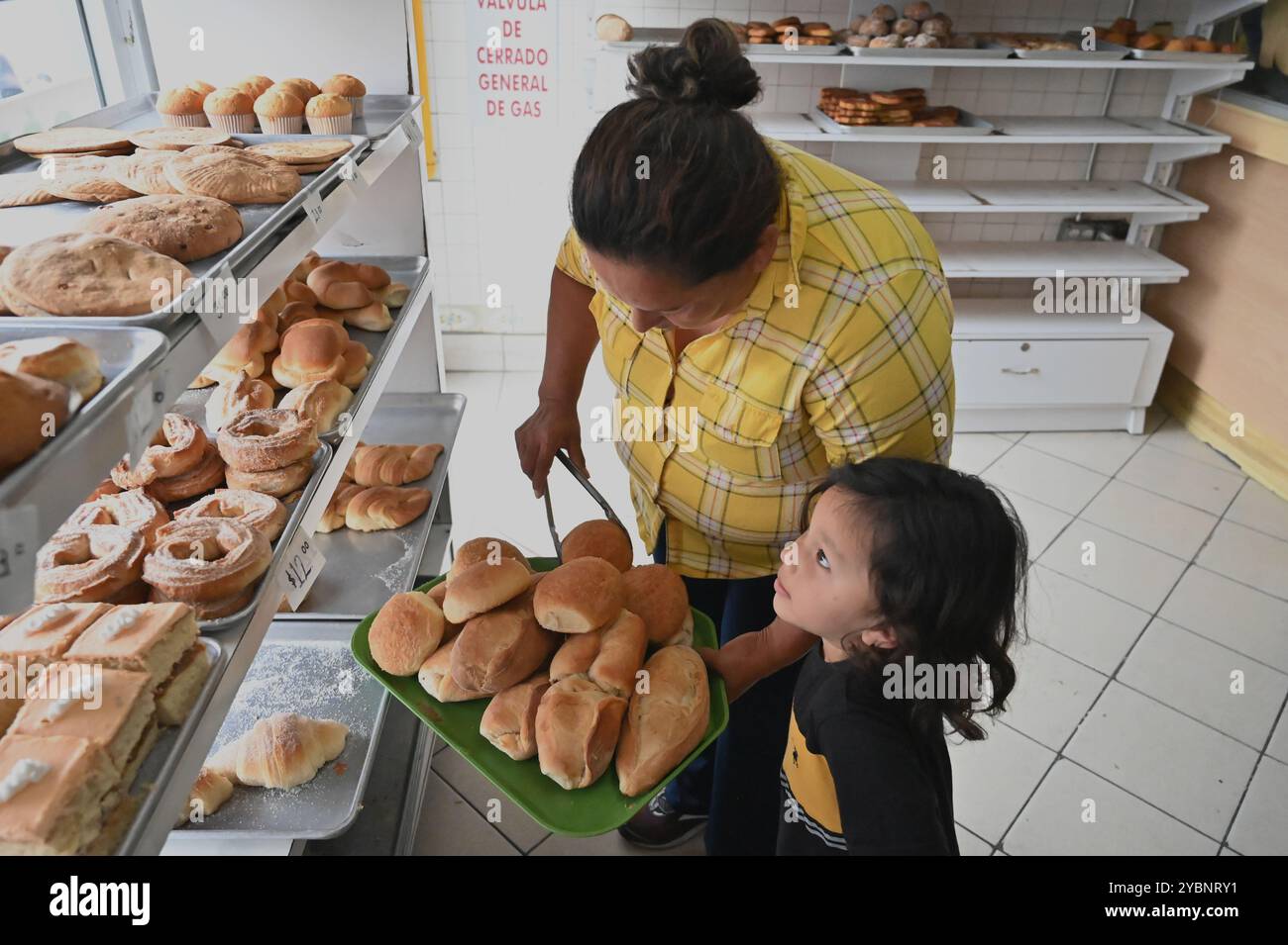 Evelina Calderon, grandmother of Leonardo Hernandez, 3, packs a tray of ...