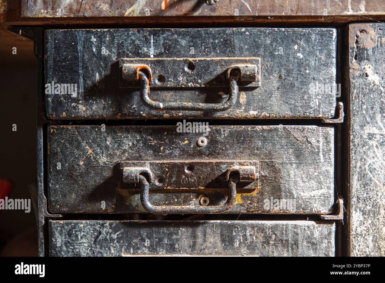 Old black metal industrial cabinet with rustic metal drawers in a ...