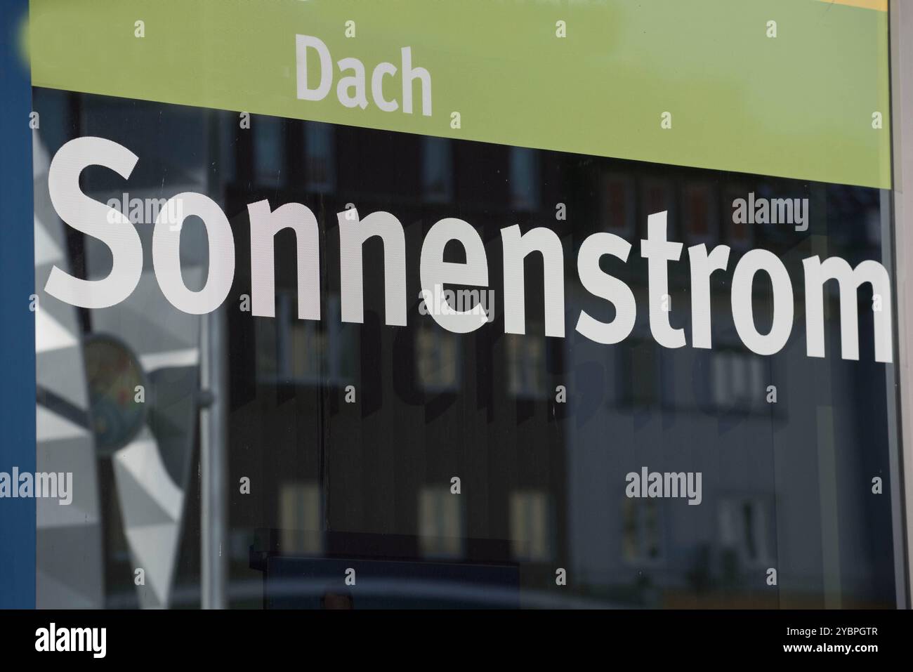 a building and photovoltaics sign, sustainable and ecological energy ...