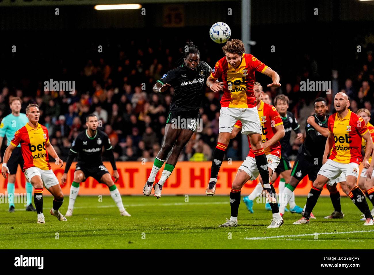 Jordan lotomba and evert linthorst compete for the headed ball hi-res ...