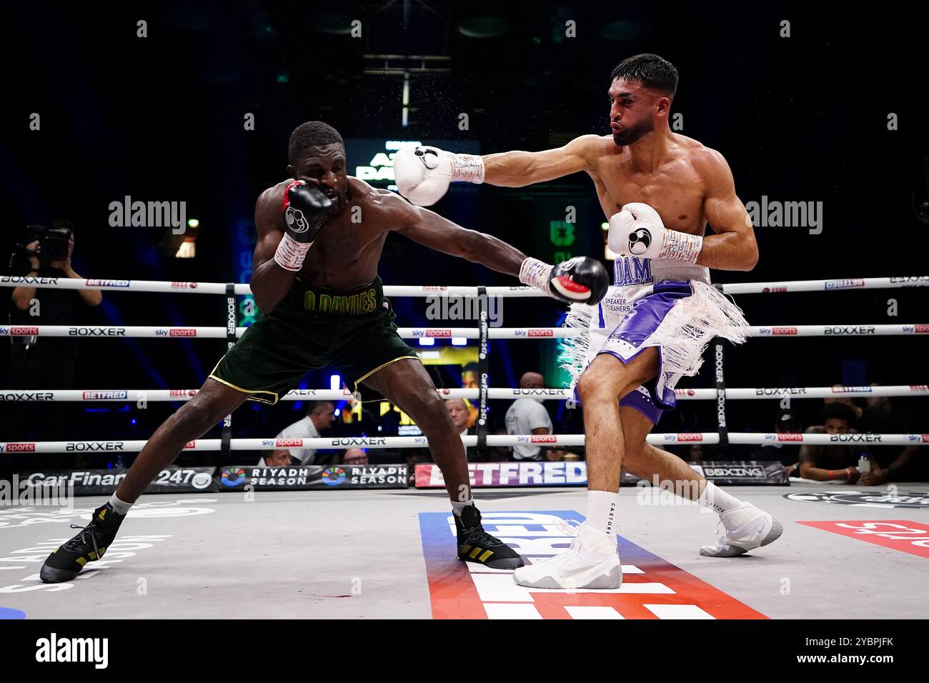 Adam Azim (right) in action during the Super-Lightweight bout against ...