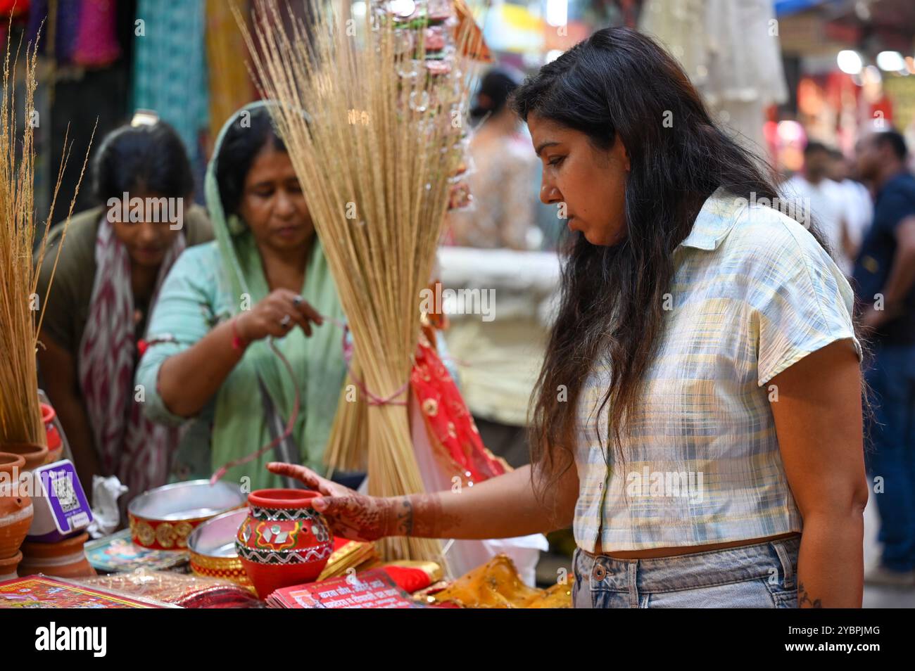 NOIDA, INDIA - OCTOBER 19: Women shop at the sector 27 market ahead of ...
