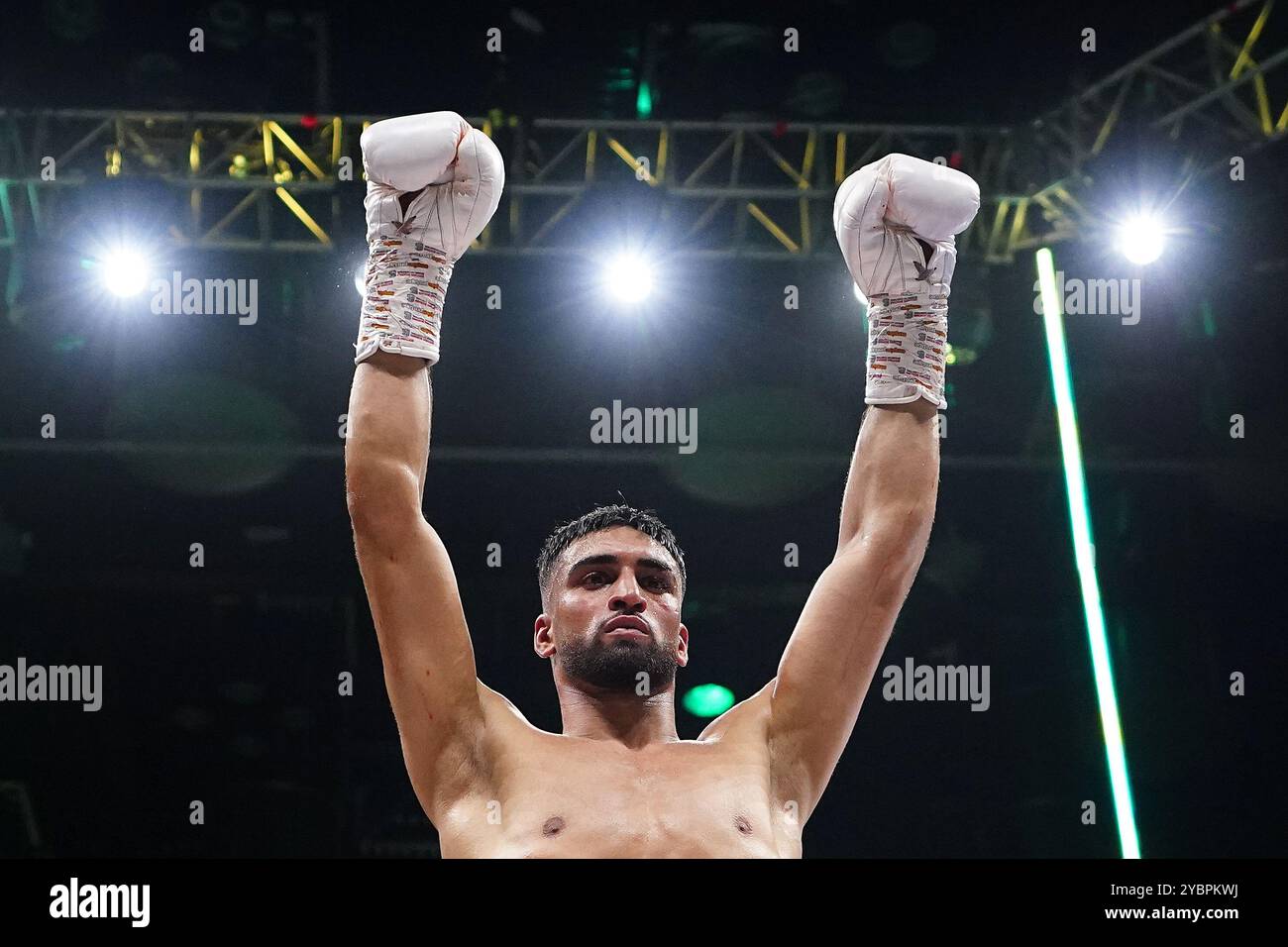 Adam Azim celebrates winning the Super-Lightweight bout against Ohara ...