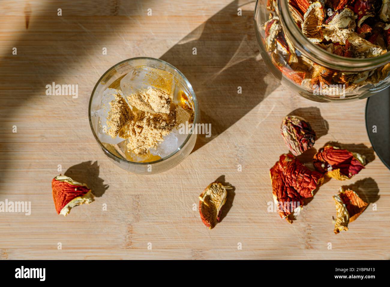 Preparation of fly agaric drink, ground powdered dry mushroom on ice ...