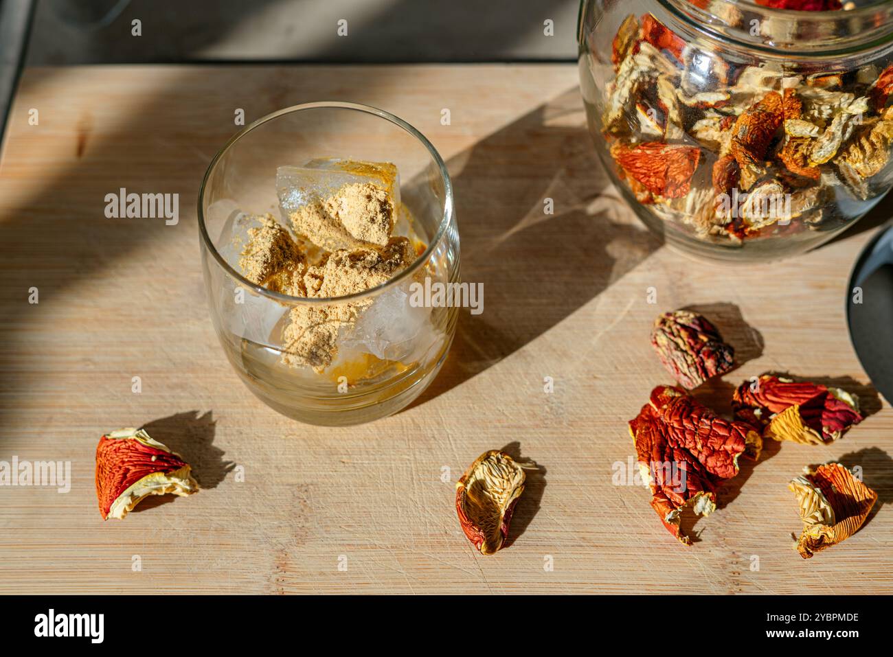 Preparation of fly agaric drink, ground powdered dry mushroom on ice ...