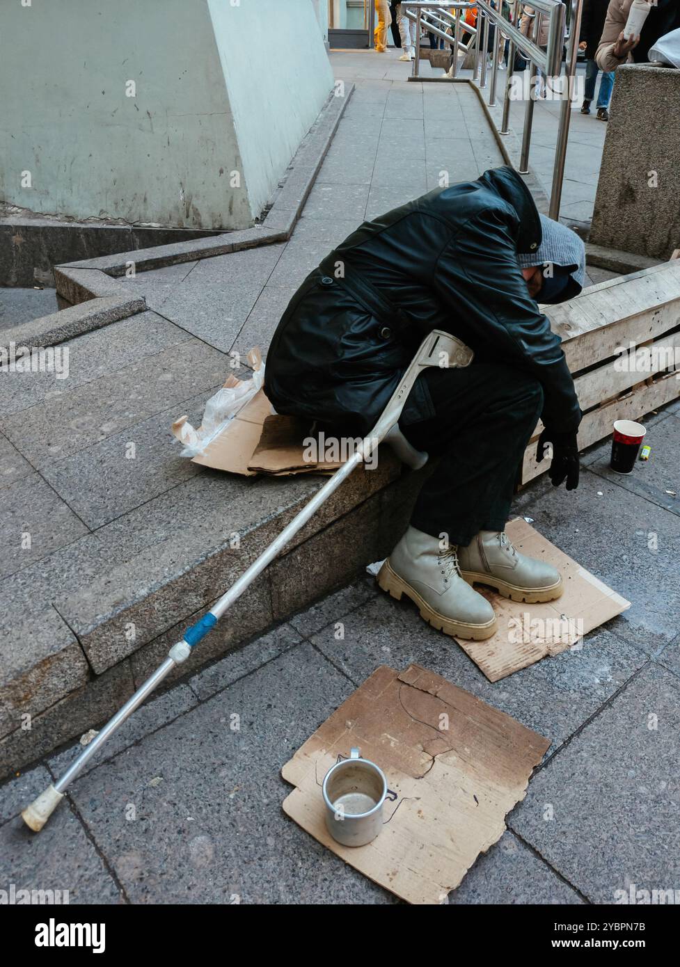 Sad homeless man begs hi-res stock photography and images - Alamy