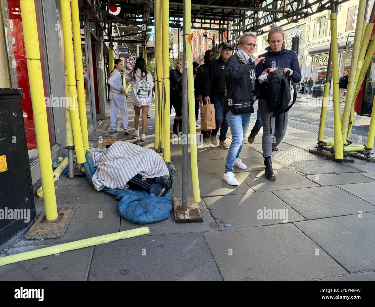 Homeless person sleeping rough on Oxford Street, London, UK Stock Photo ...