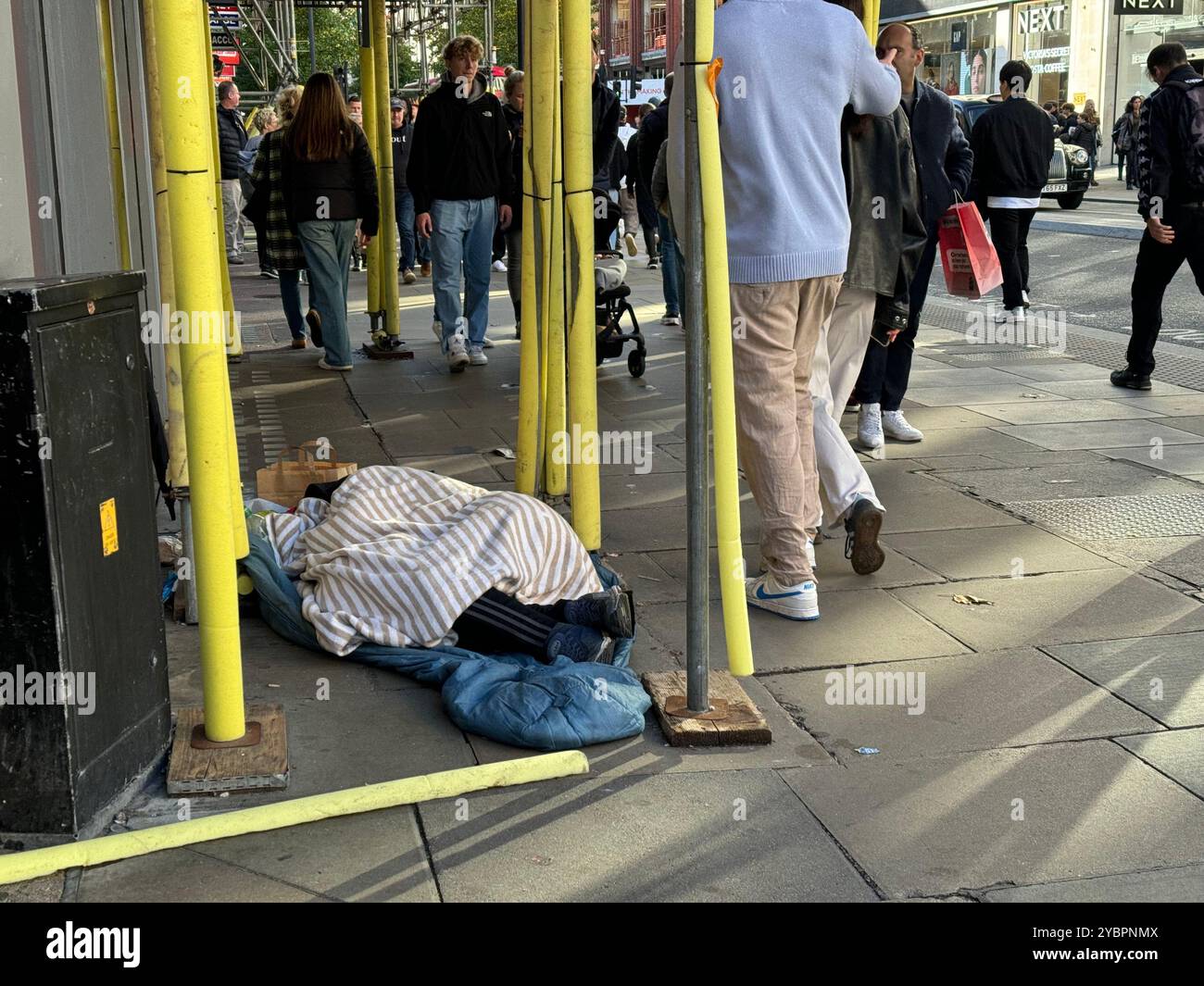 Homeless person sleeping rough on Oxford Street, London, UK Stock Photo ...