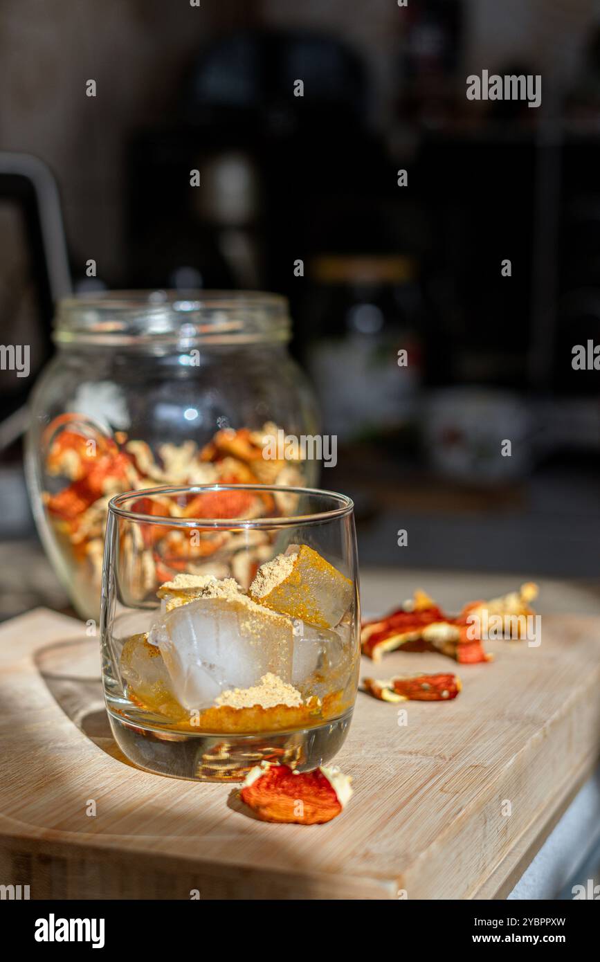 Preparation of fly agaric drink, ground powdered dry mushroom on ice ...