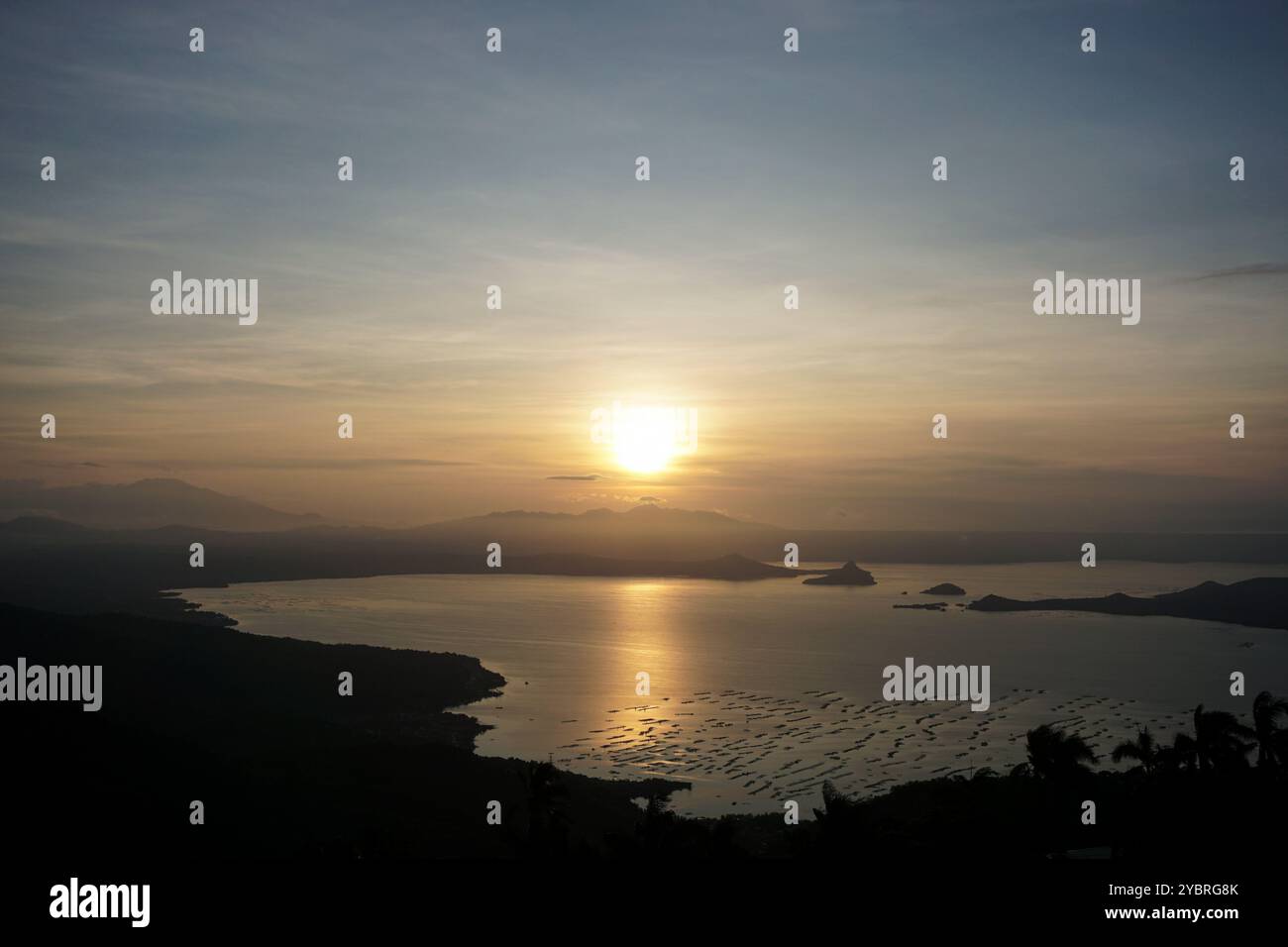 Tagaytay, Philippines. Sun rising over Taal Lake Stock Photo - Alamy