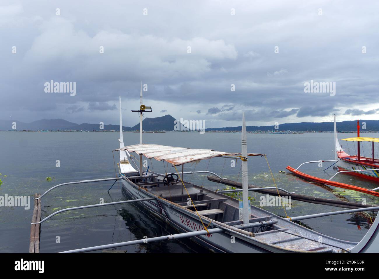 Tagaytay, Philippines. Banka boats lay idle on the banks of Taal Lake ...