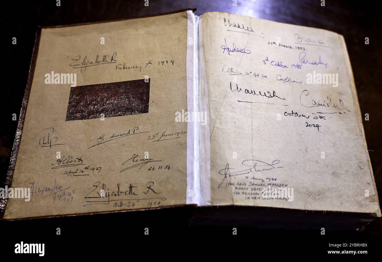 The signatures of King Charles III and Queen Camilla are seen along ...
