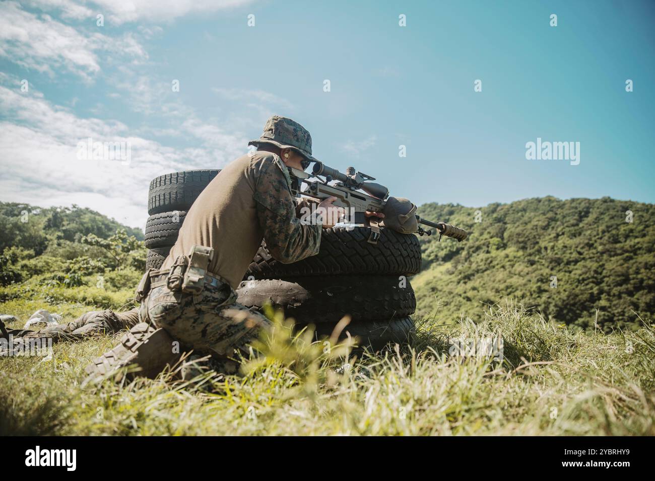 A U.S. Marine assigned to Weapons Company, Battalion Landing Team 1/5 ...