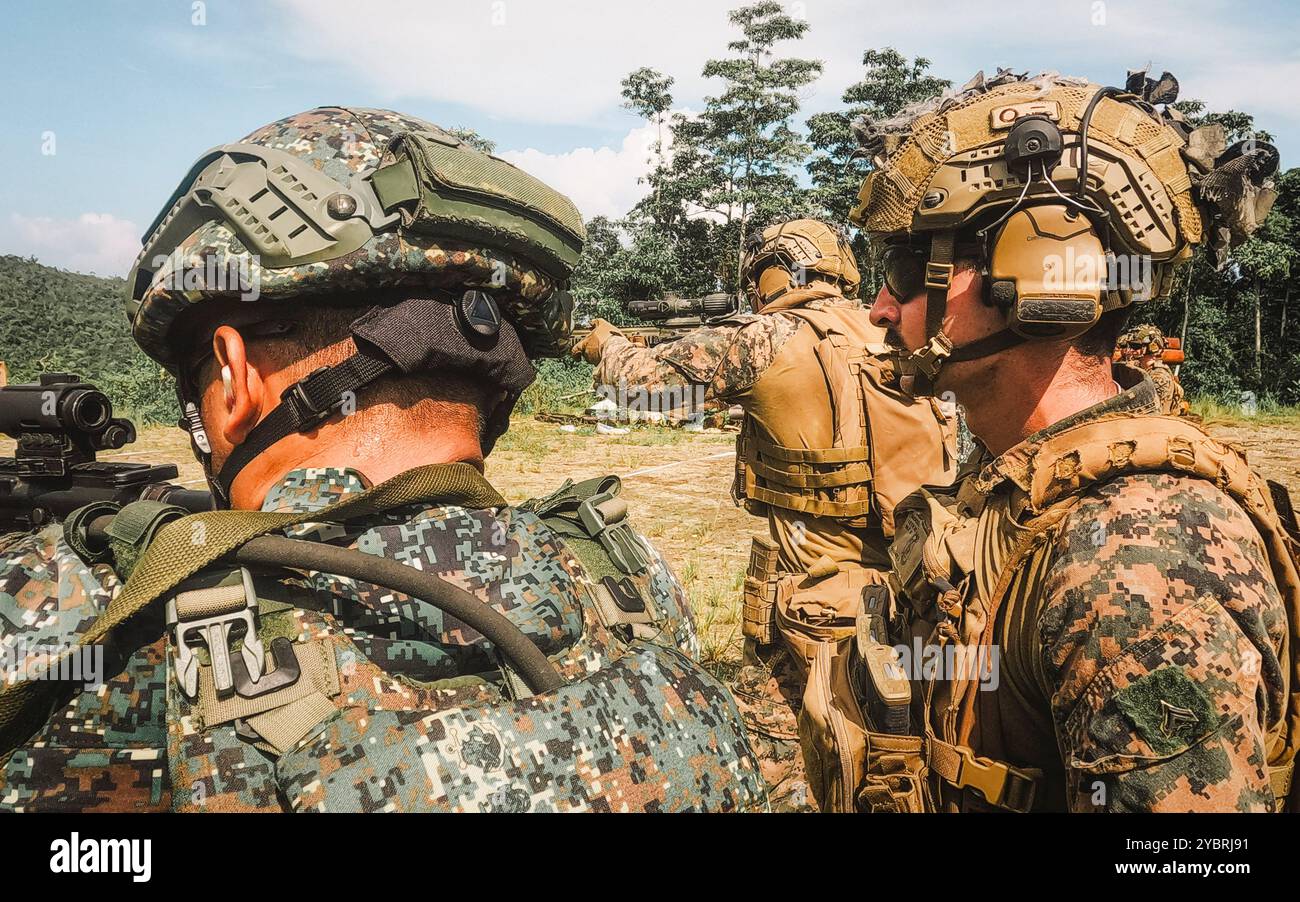 U.S. Marine Corps Cpl. Joseph Mendez, right, a team leader assigned to ...