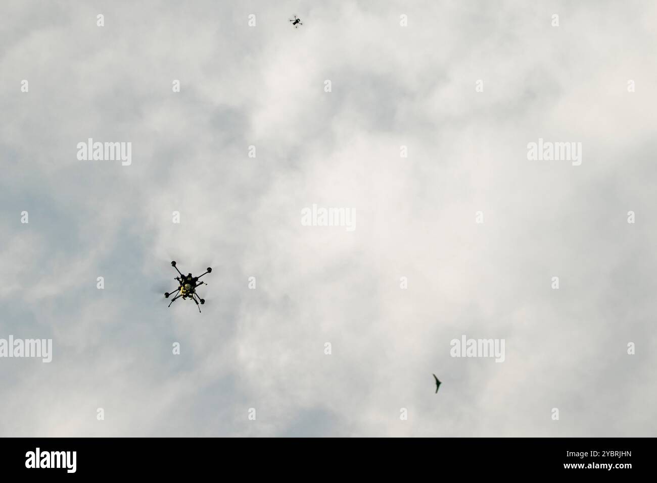 A U.S. Marine Corps R80D SkyRaider, left, and Anafi Parrot, top, fly ...