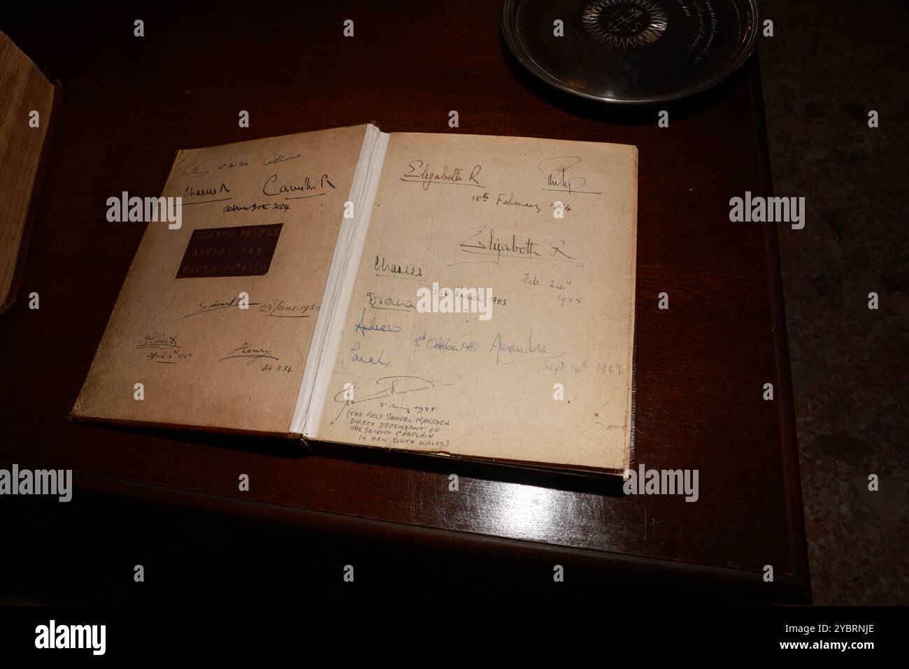 The signatures of King Charles III and Queen Camilla are seen along ...