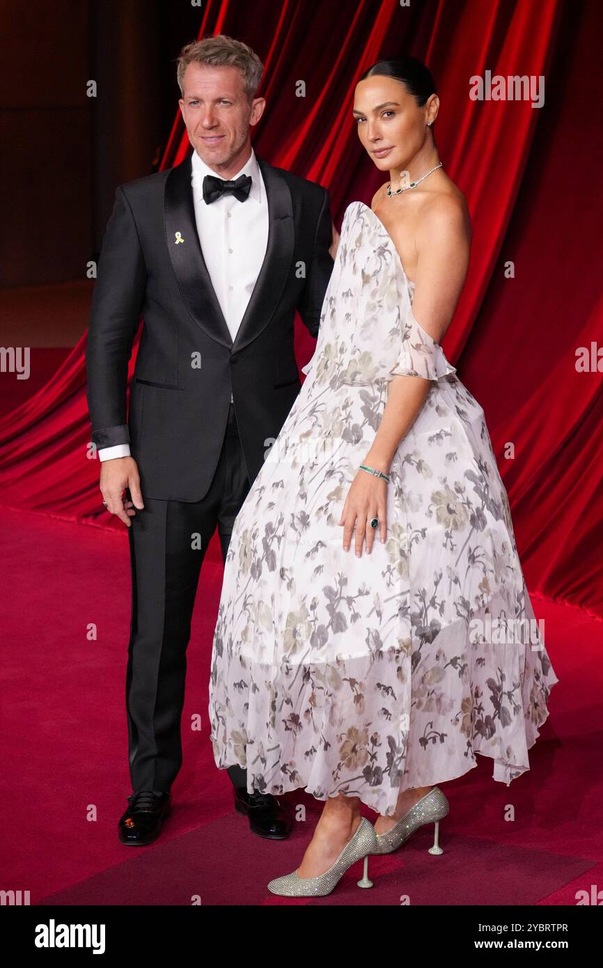 Jaron Varsano, left, and Gal Gadot arrive at the fourth annual Academy ...