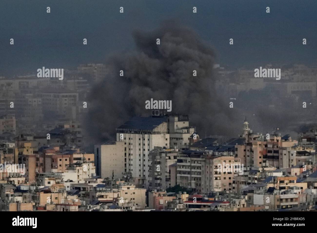 Smoke rises from Israeli airstrikes on Dahiyeh, in the southern suburb ...
