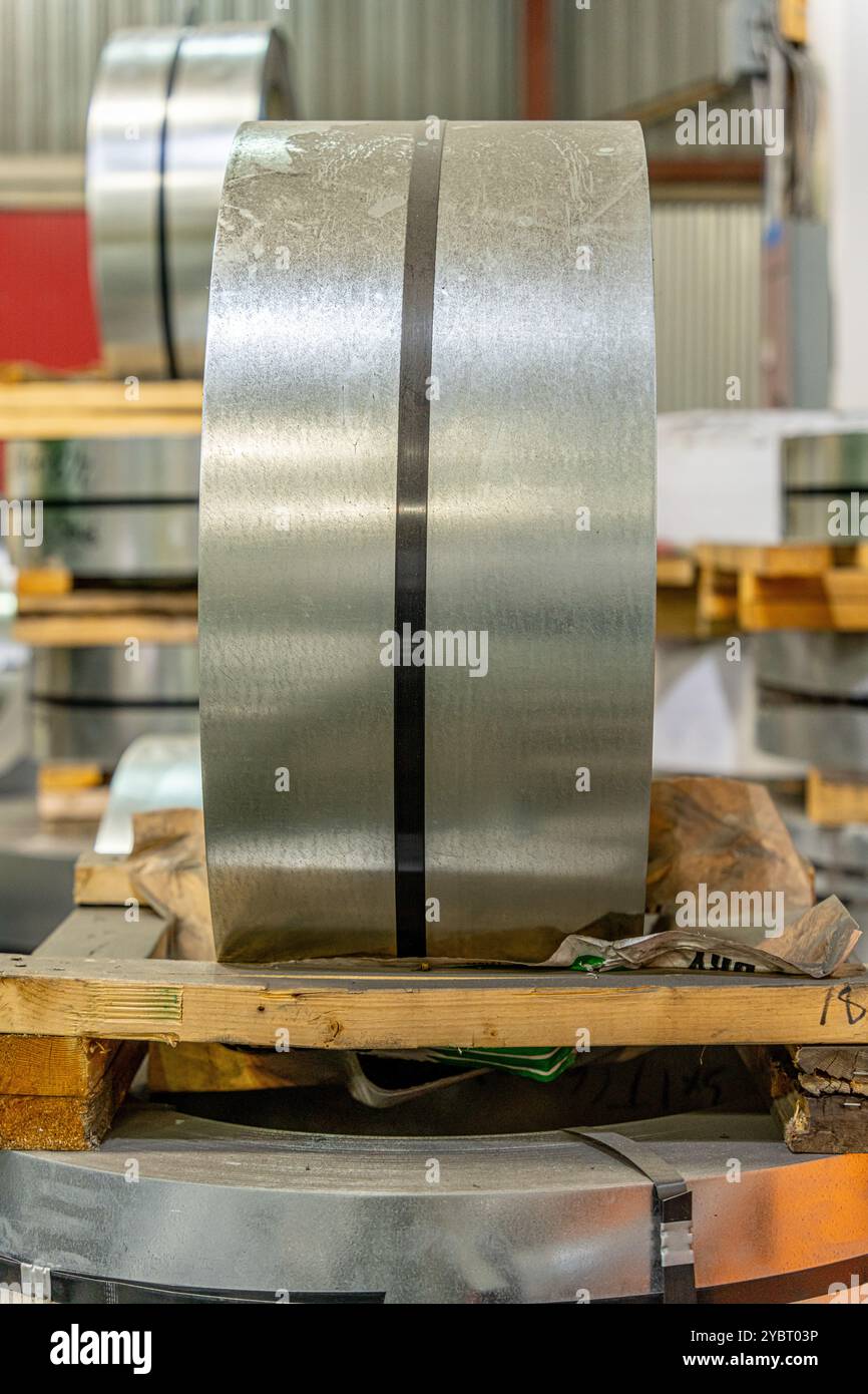 Steel metal roll coils in metal factory workshop Stock Photo - Alamy