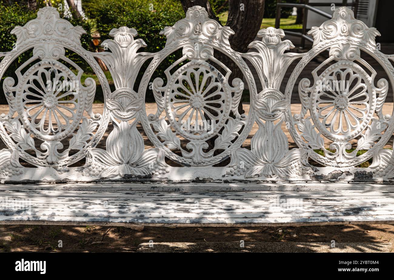 Details of White painted cast iron victorian style garden bench in city ...