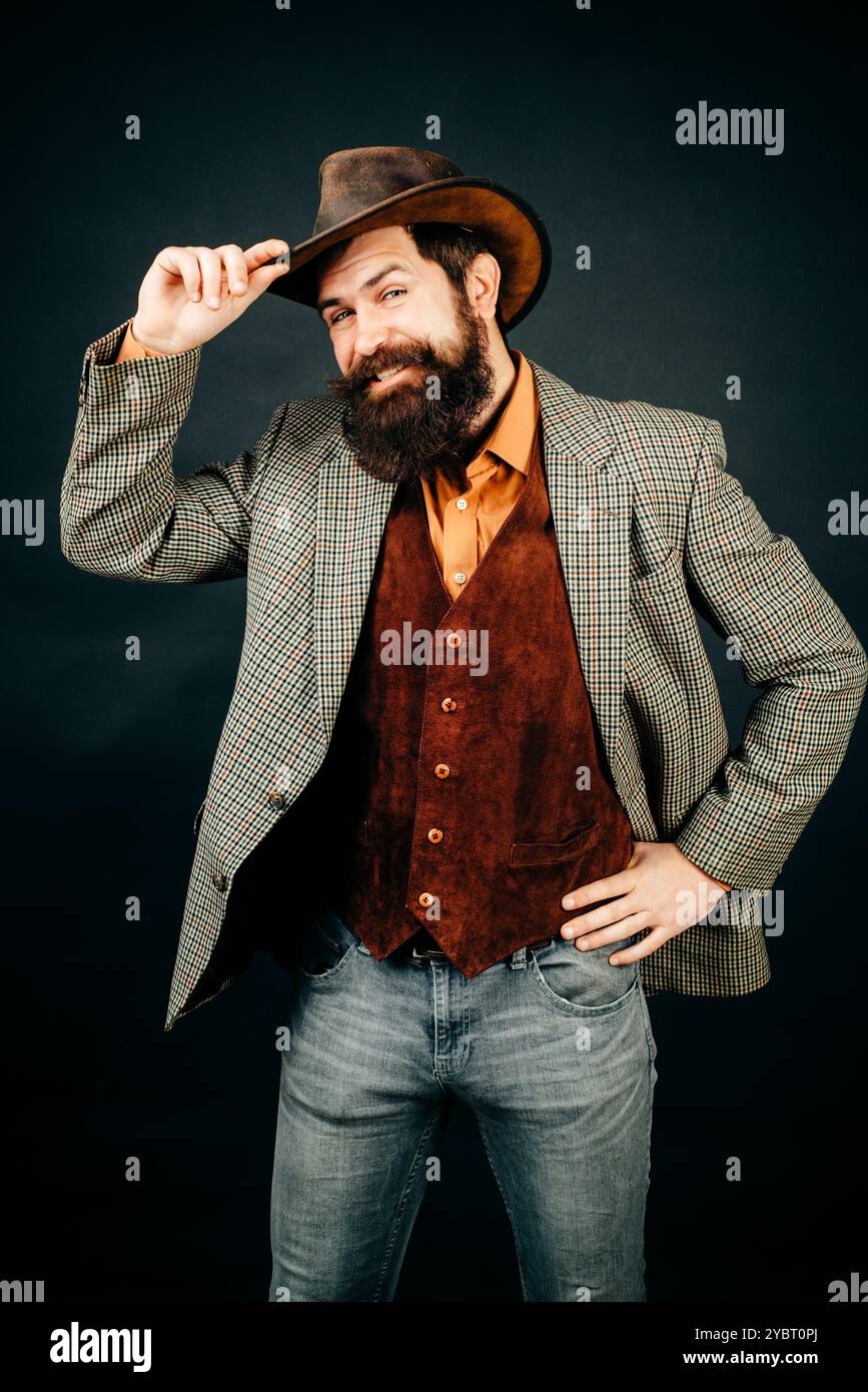Happy old fashioned hipster cowboy in cowboy hat. American cowboys ...