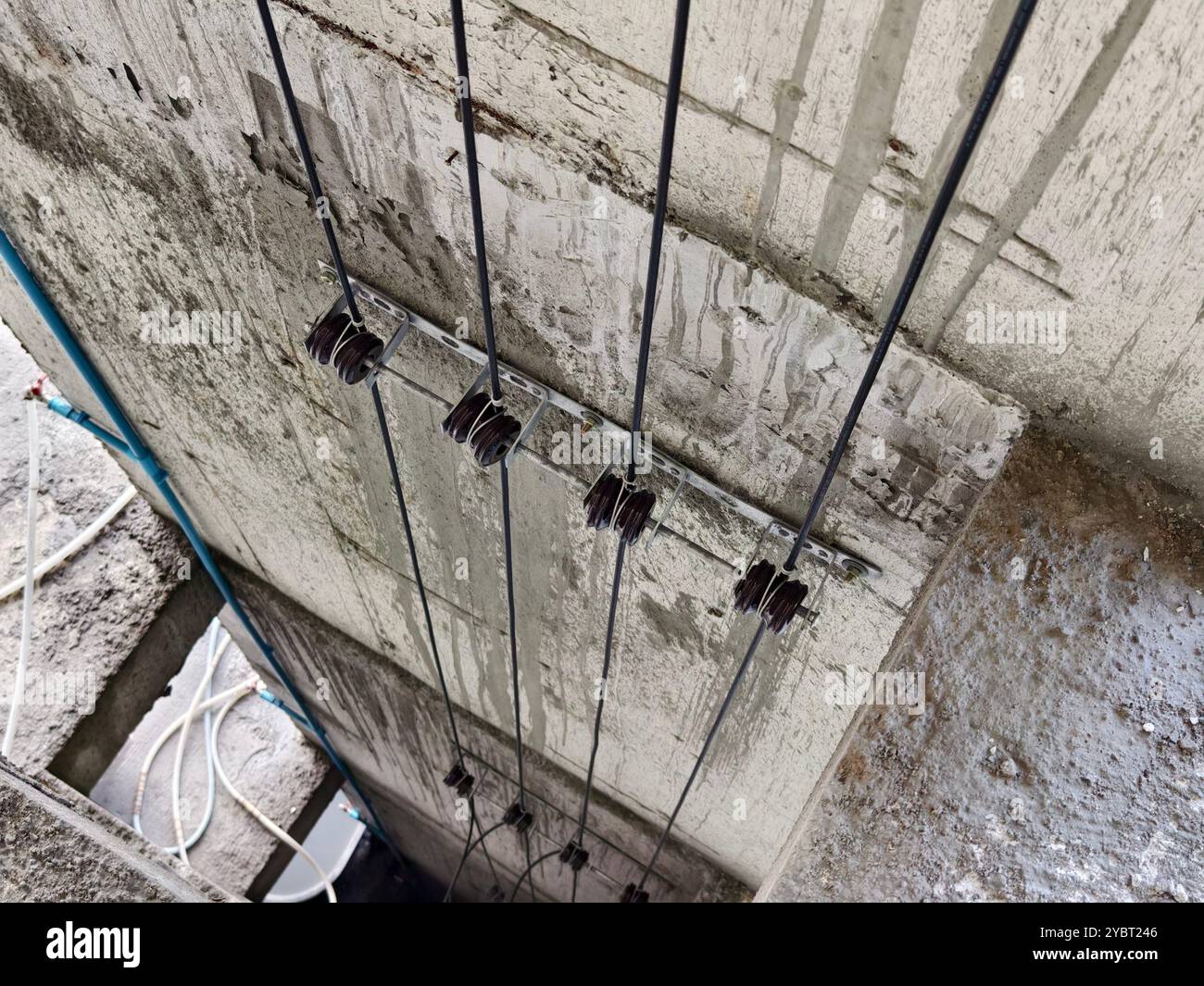 Cables in an elevator shaft at a new building construction site Stock ...