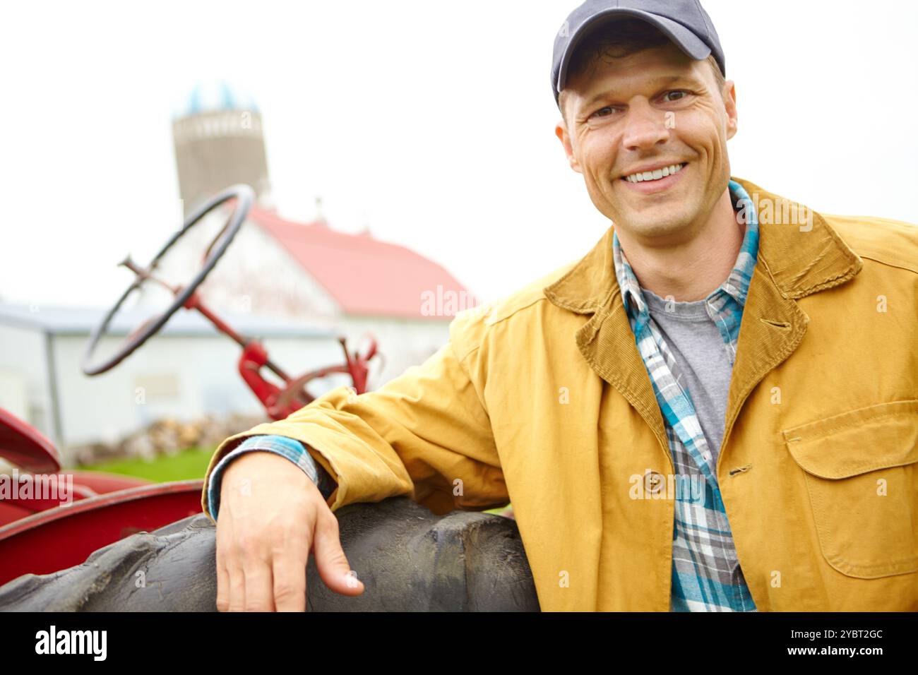 Farm, portrait and happy man with tractor for harvesting, agriculture ...