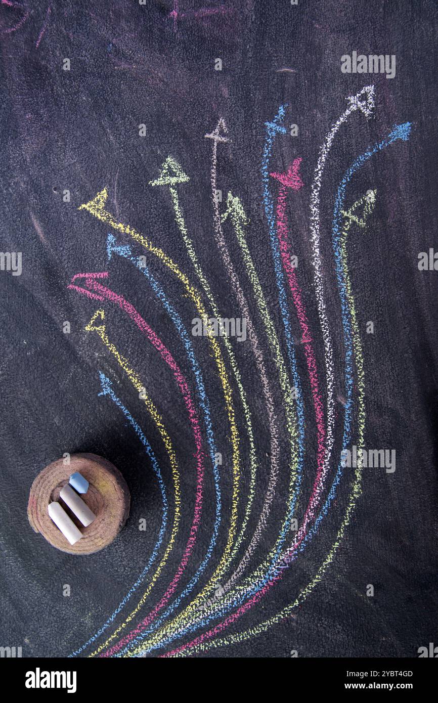 Curved colored arrows drawn with chalk on blackboard Stock Photo - Alamy