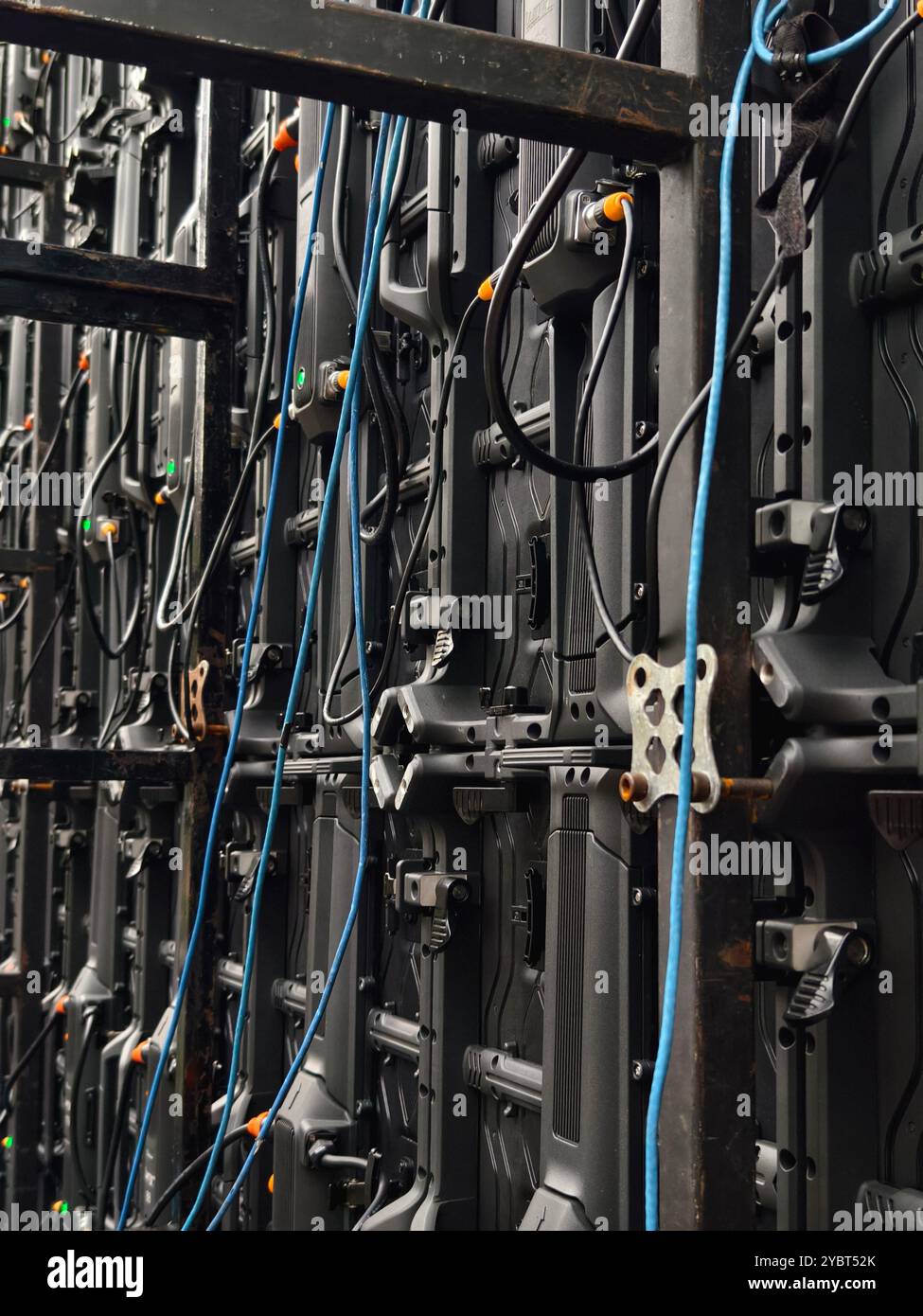 A bunch of electrical wires and connectors are hanging down from a led ...