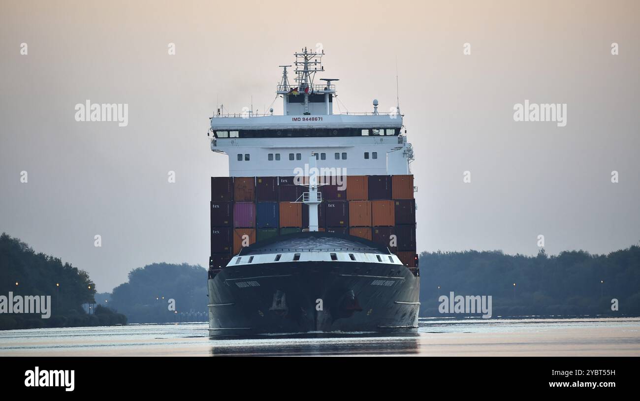 Container ship Nordic Porto sailing at sunrise in the Kiel Canal, Kiel ...
