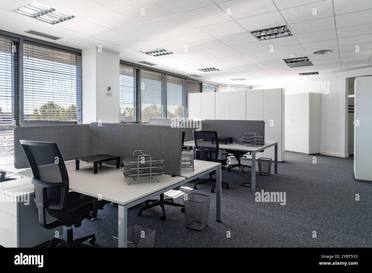 Empty places for workers in contemporary coworking. Startup business office interior at new ...