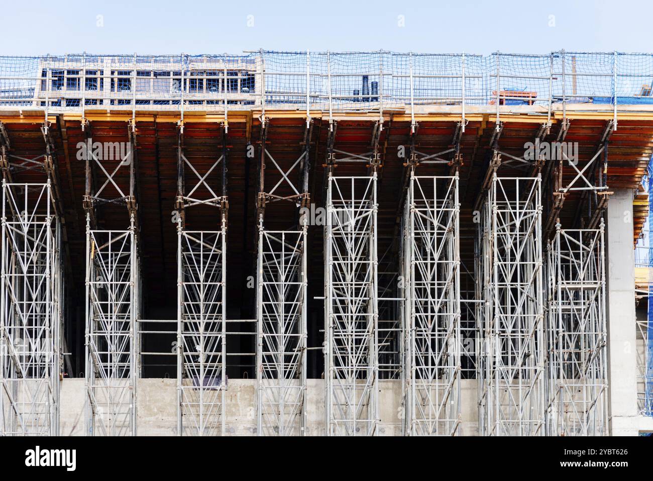 Scaffolding in construction site of modern office building. Engineering ...