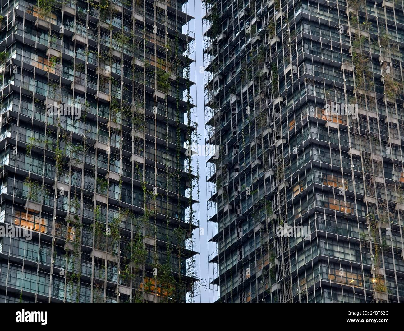 A very tall building that features numerous windows and many balconies ...