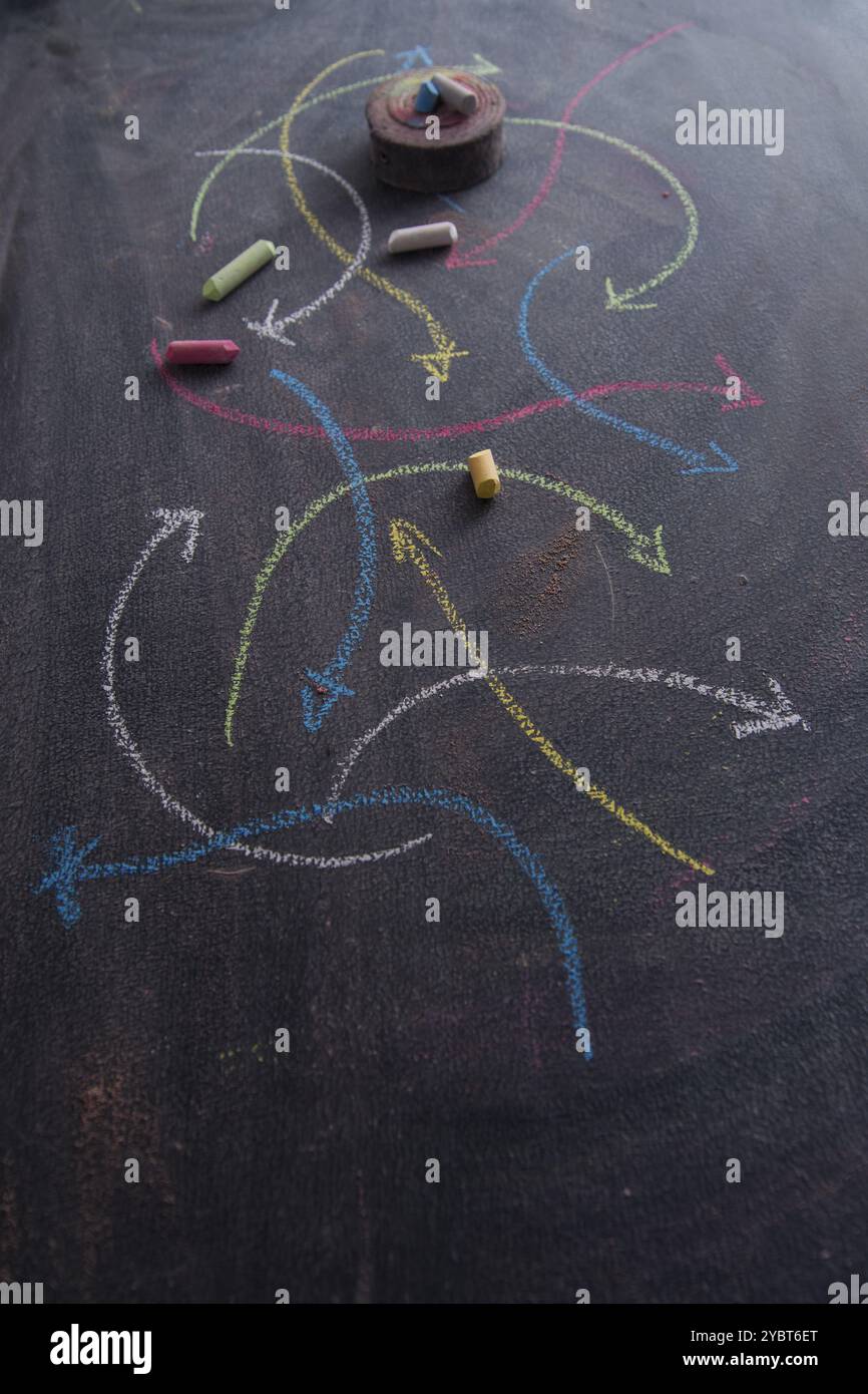 Curved colored arrows drawn with chalk on blackboard Stock Photo - Alamy