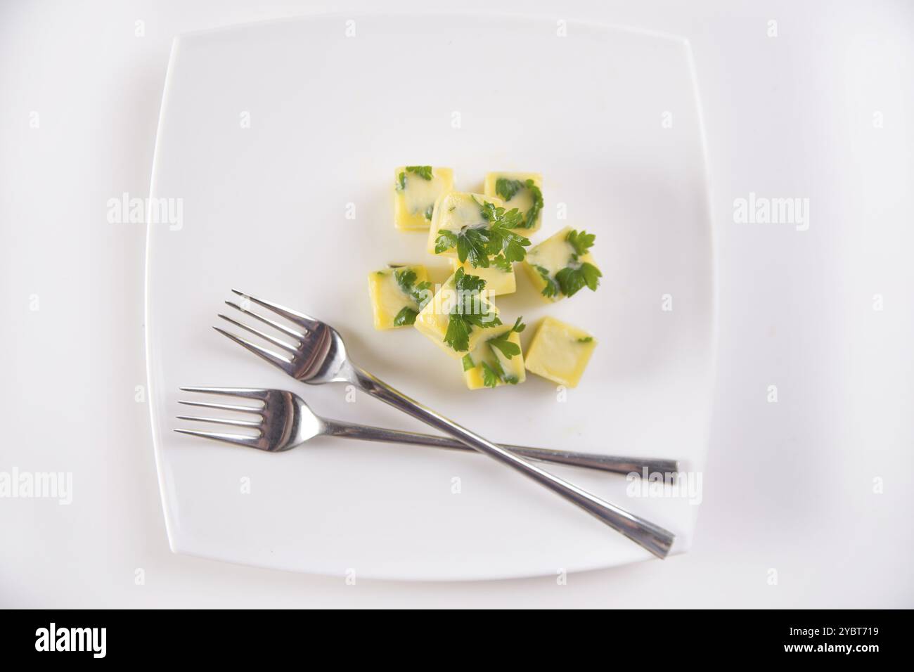 Frozen cubes of extra virgin olive oil flavored with parsley Stock ...
