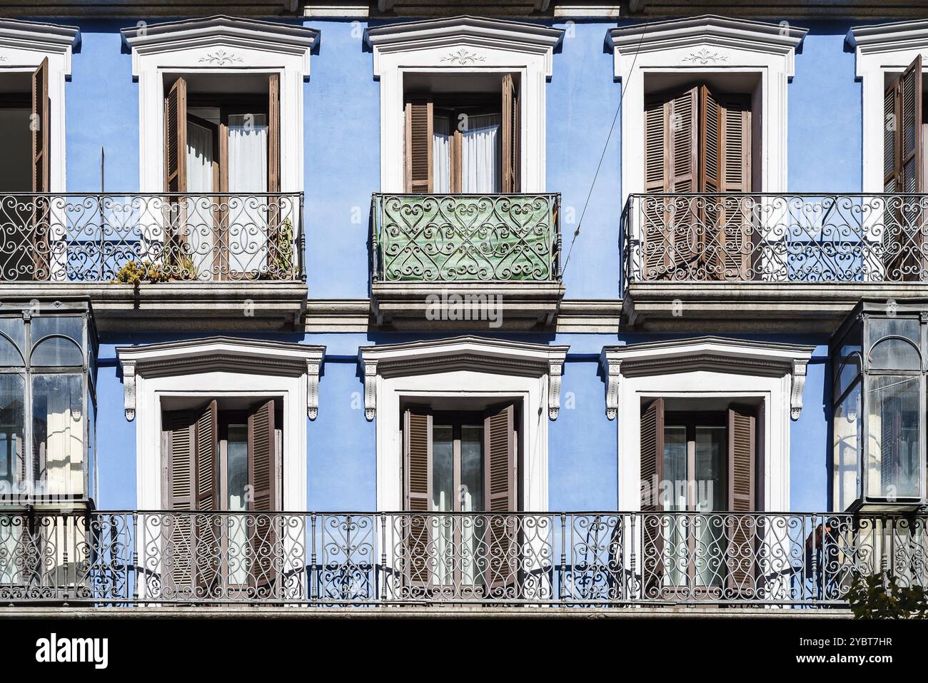 Old colorful residential building in central Madrid with iron balconies ...