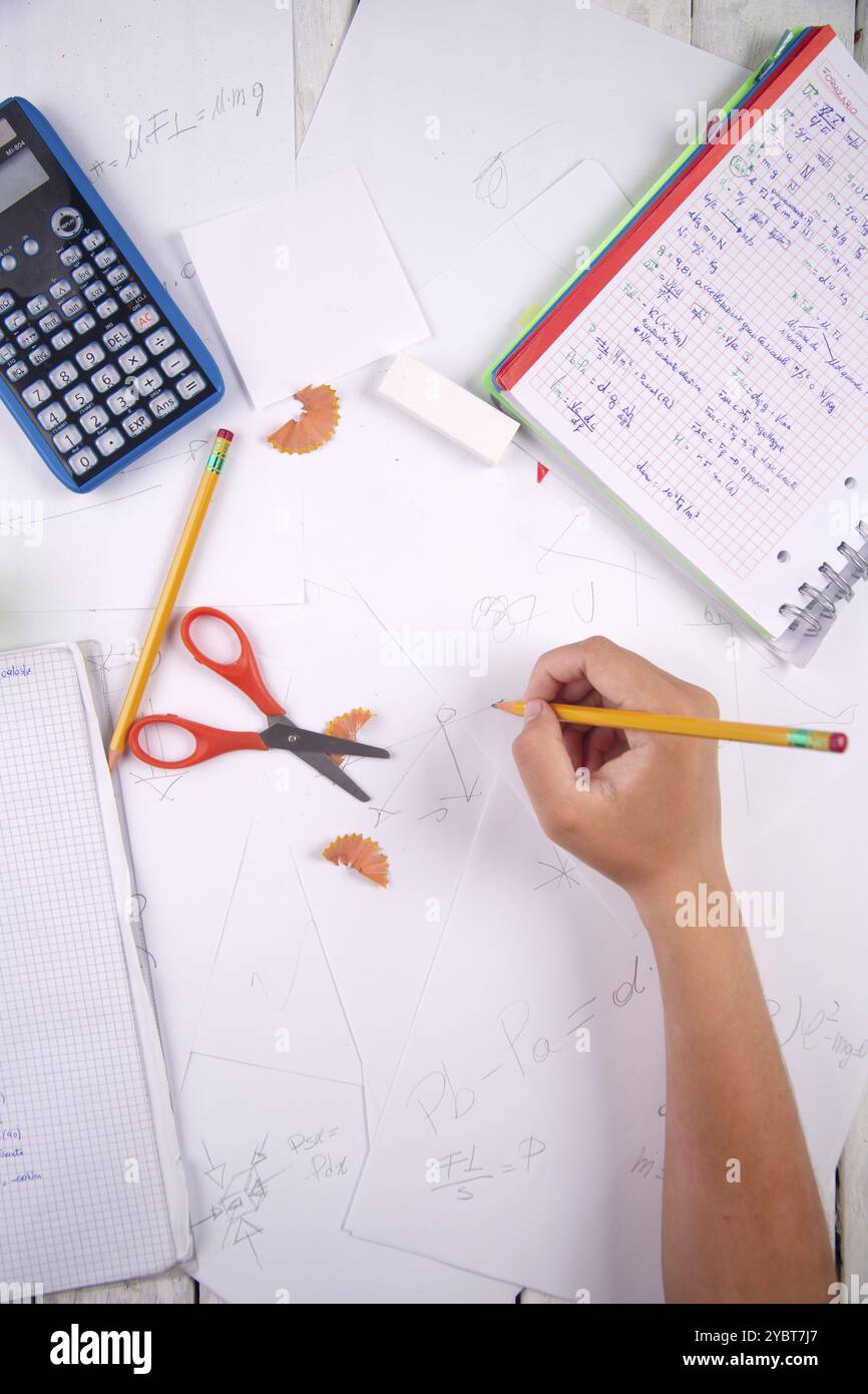 Study table with sheets for applications of a problem Stock Photo - Alamy