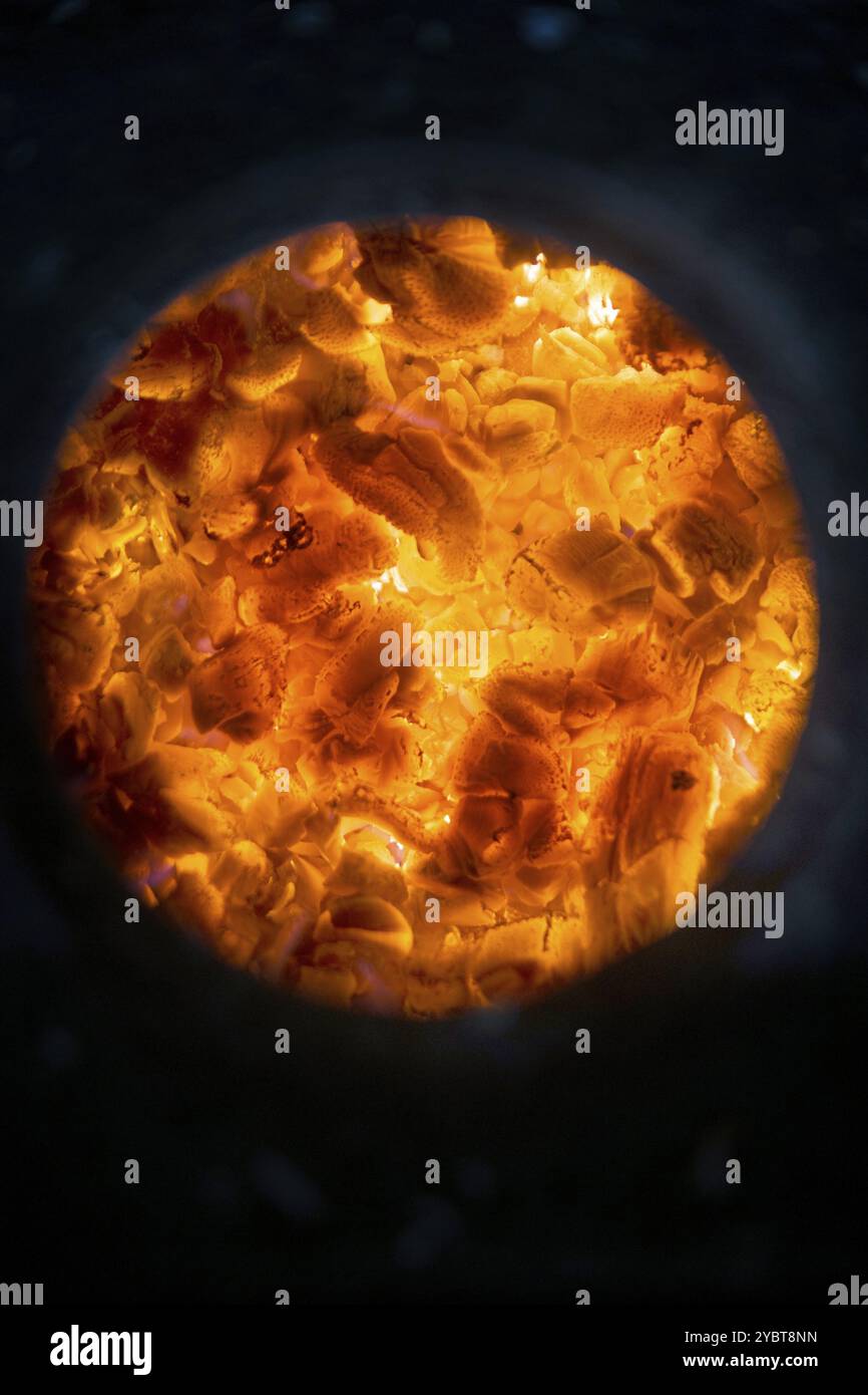 Embers from the burning of wood in a stove Stock Photo - Alamy