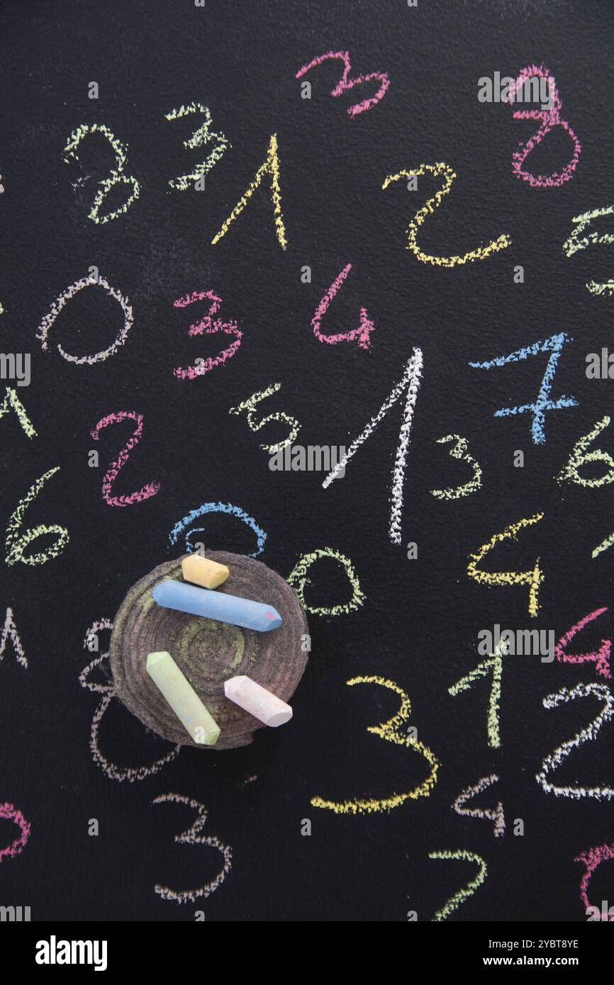 Graphic representation with chalk on blackboard with colorful numbers ...
