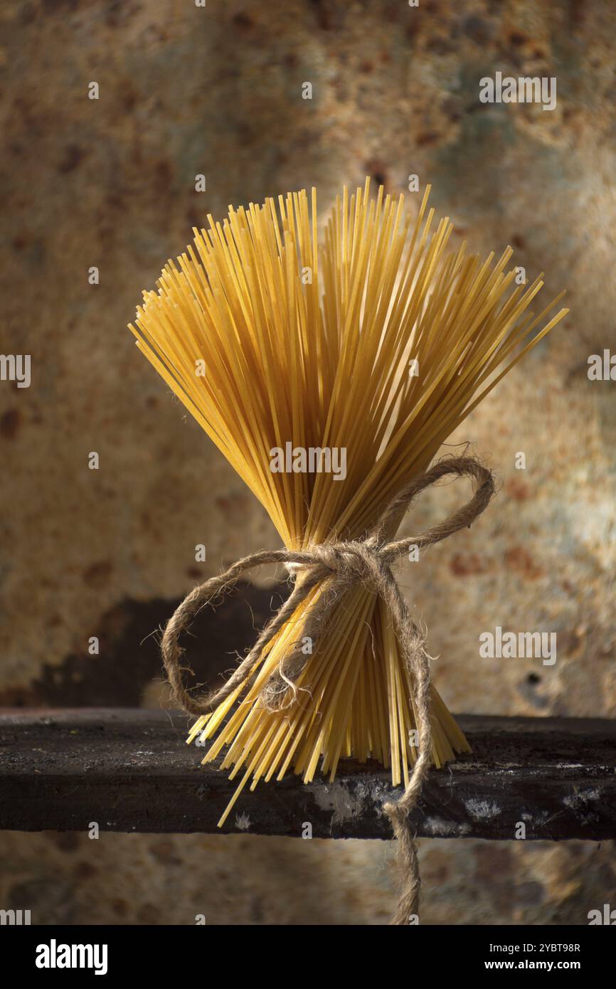A bunch of spaghetti, typical hard cheese of the Italian cuisine Stock ...