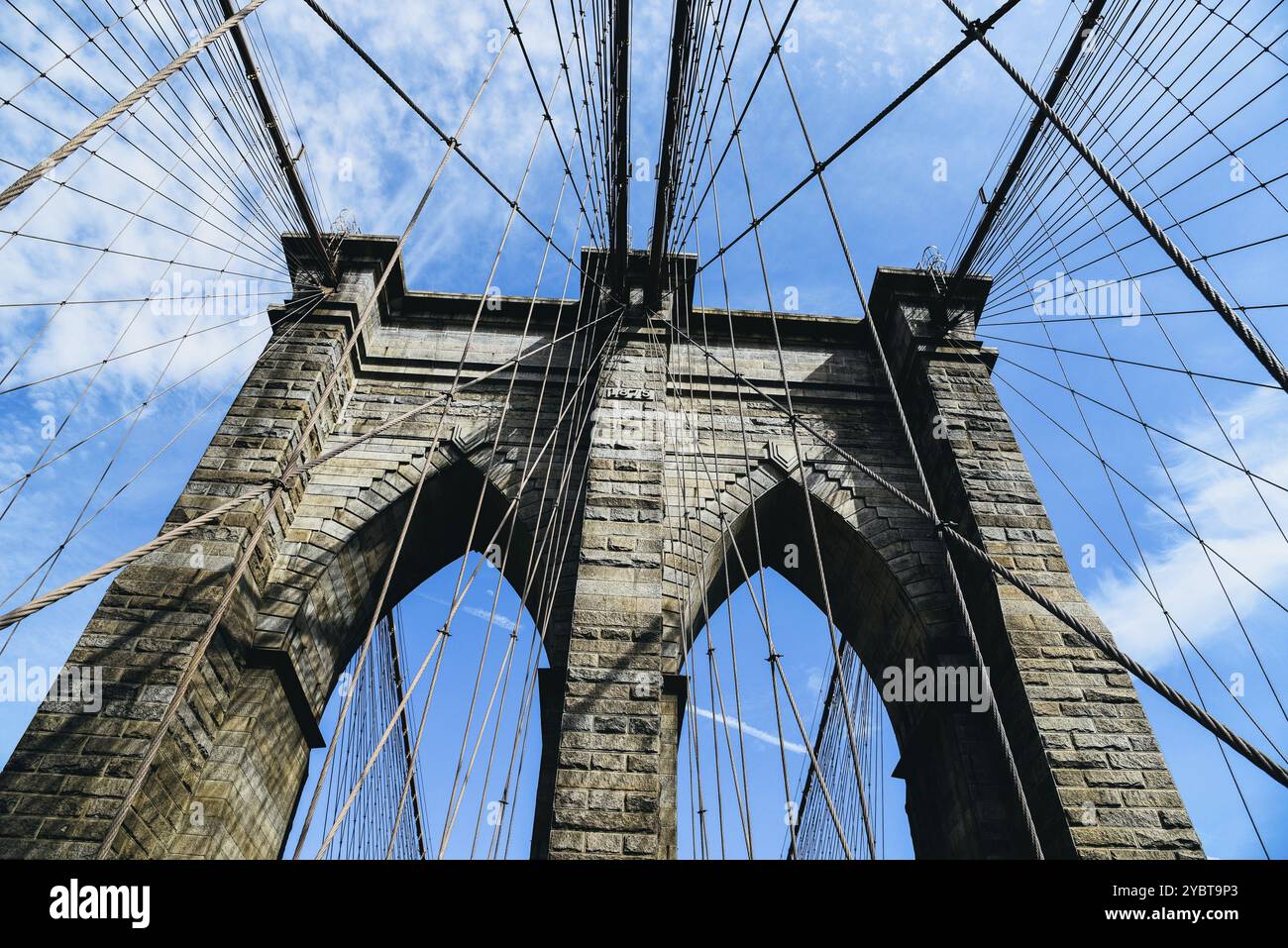Low angle view of Brooklyn Bridge in New York City. Iconic View of NYC ...