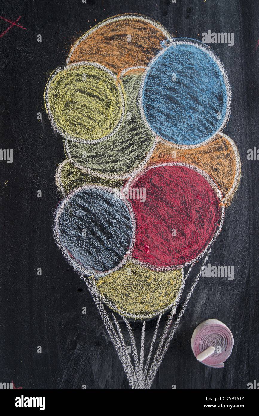 Graphic representation of colored balloons drawn with chalk on ...