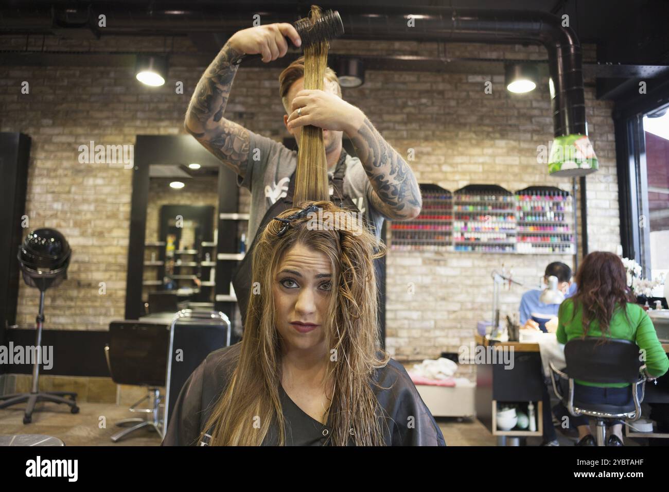 Woman having haircut in hair hi-res stock photography and images - Alamy